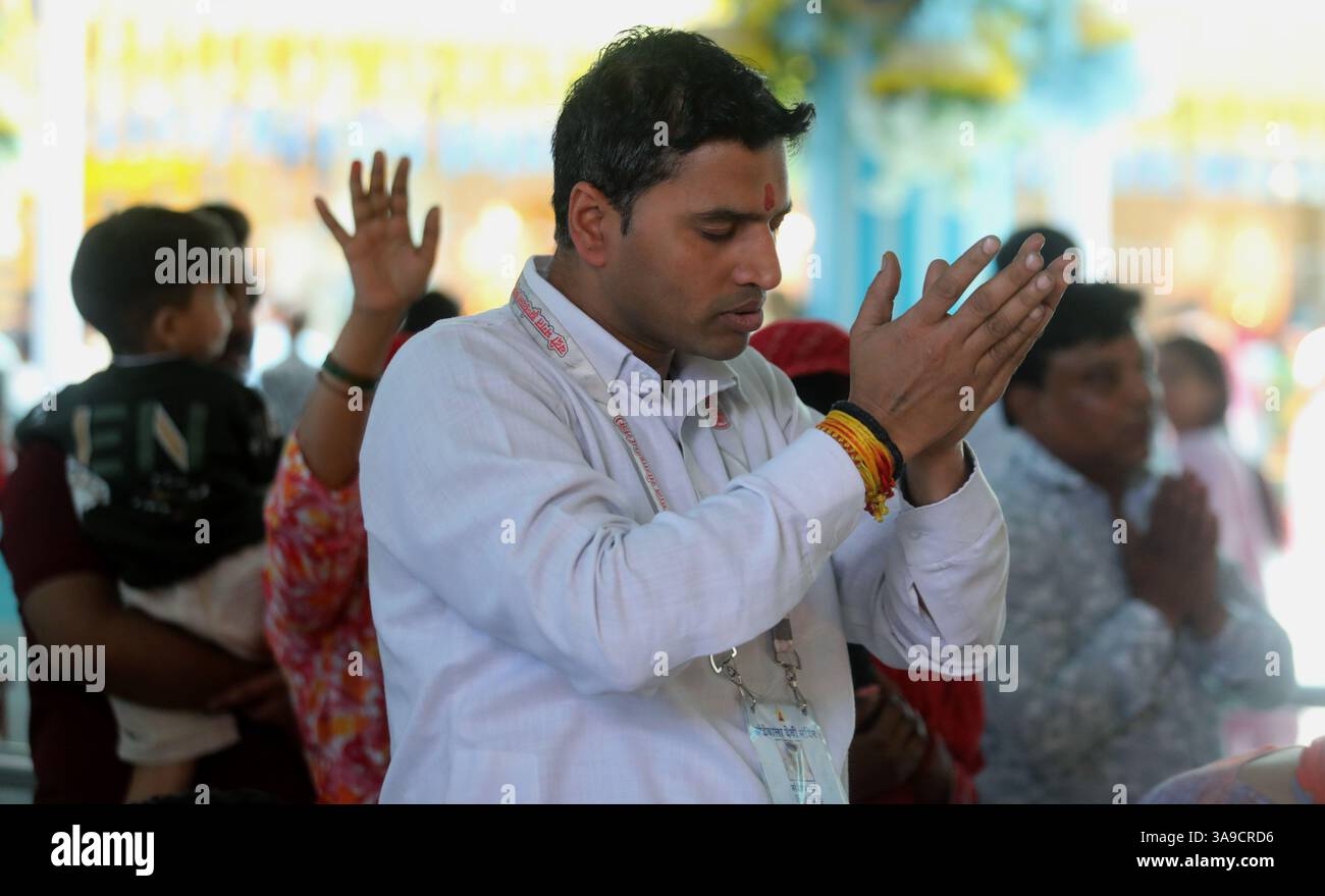 Indian devotees offer prayers during the Hindu Navaratri festival at ...