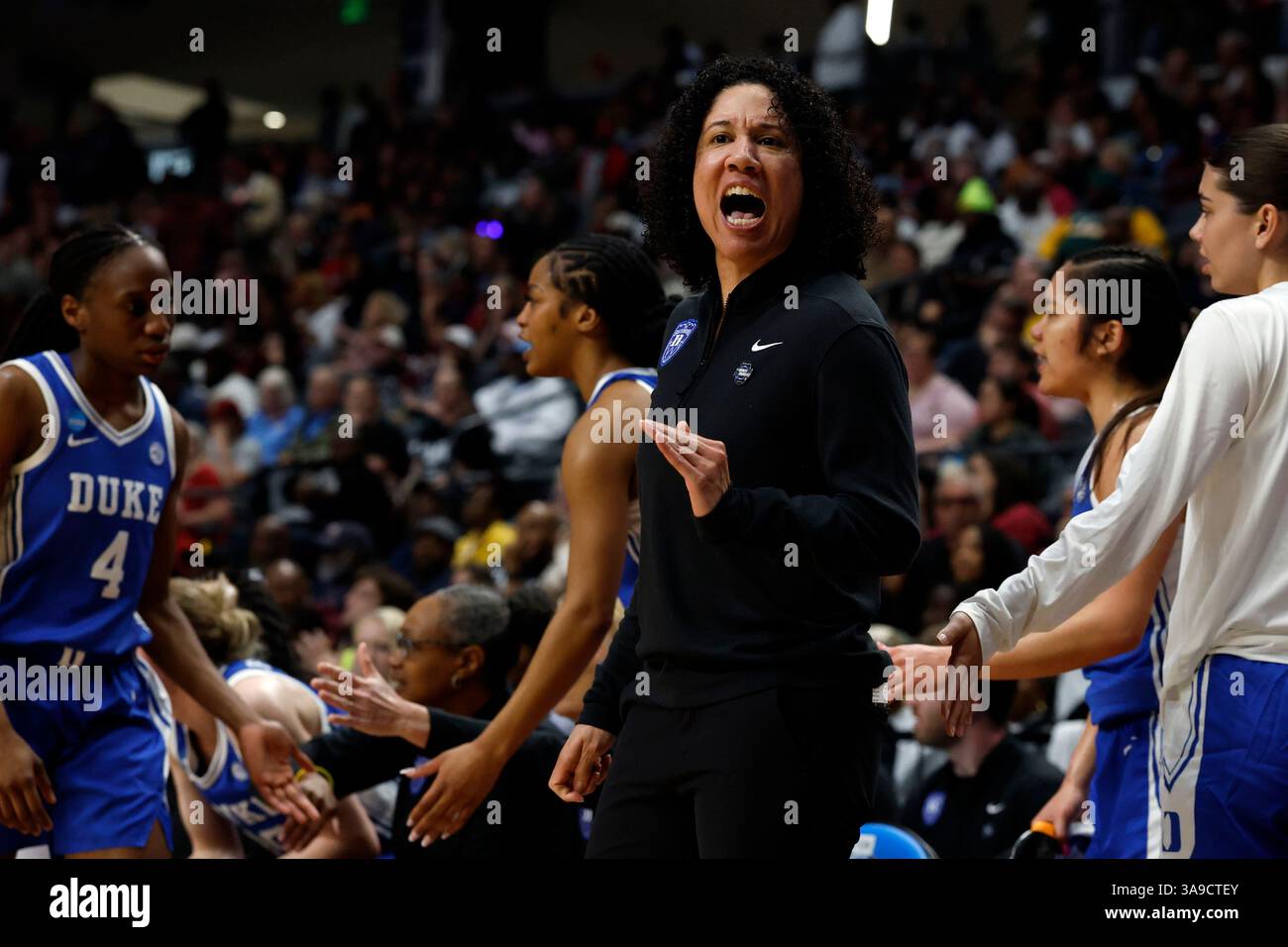 Duke head coach Kara Lawson, center right, reacts during the first half ...