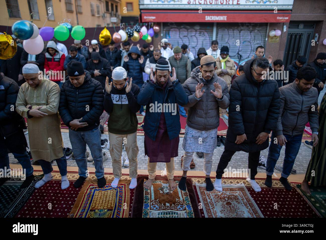 Madrid, Spain. 30th Mar, 2025. Muslims perform Eid al-Fitr prayers to ...