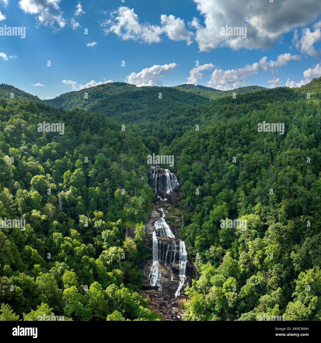 Beautiful landscape of high waterfall with falling down clear water ...