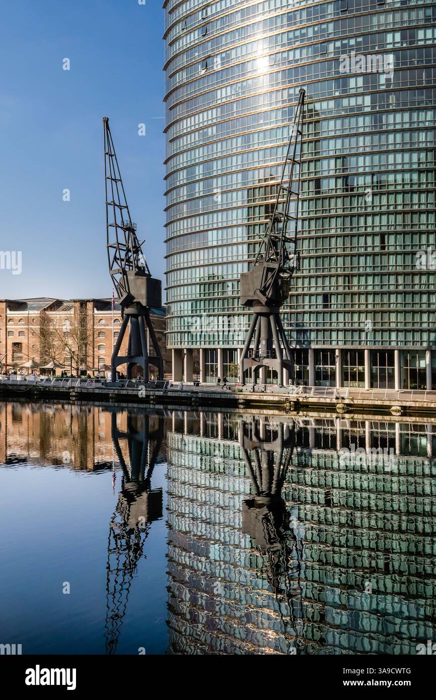 LONDON, UK - MARCH 26, 2025: Old dock cranes at West India Quay with ...