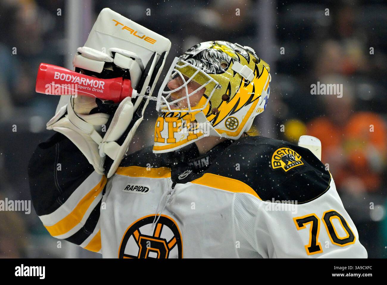 Boston Bruins goaltender Joonas Korpisalo cools off during a stoppage ...