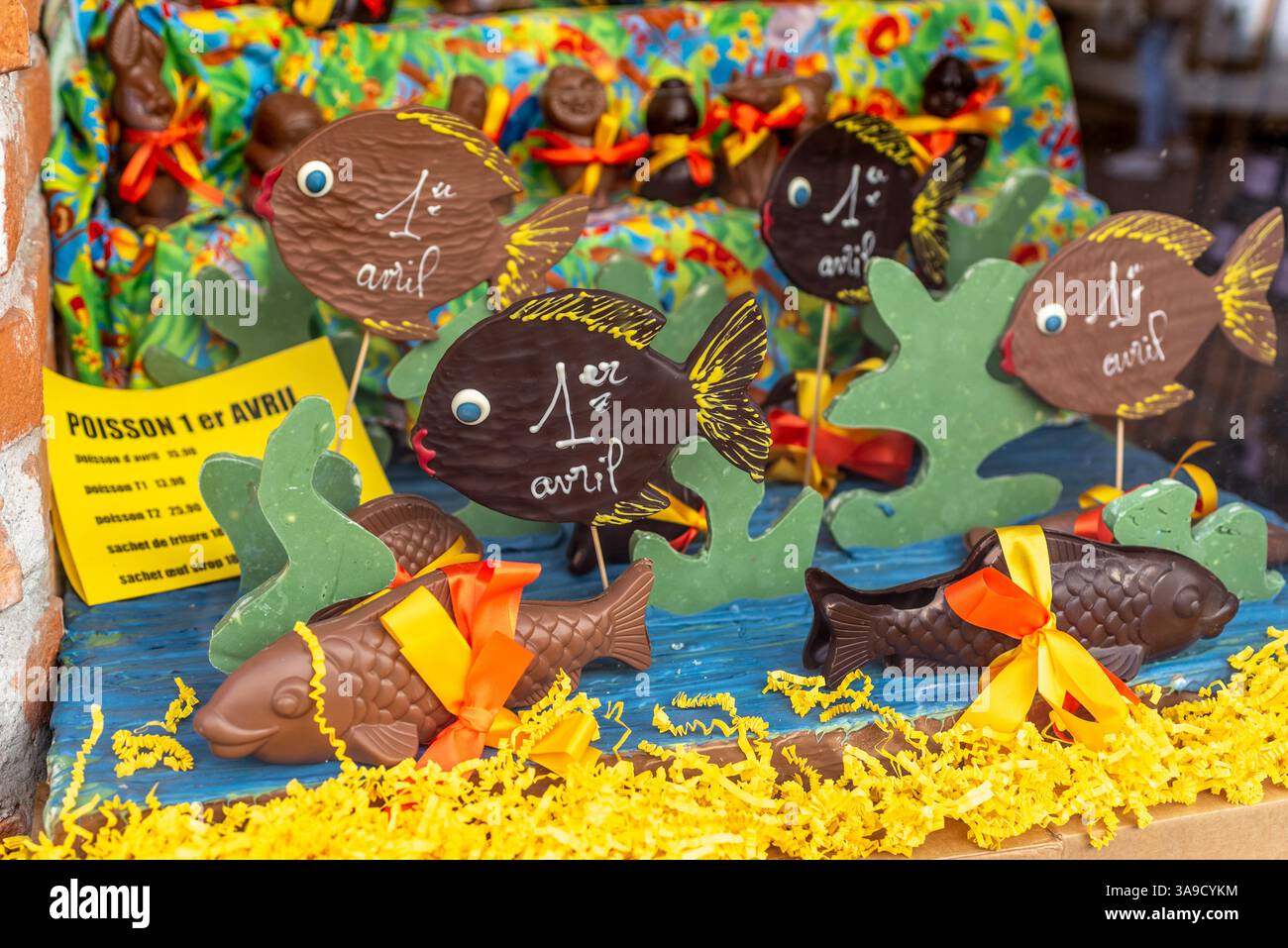 Milk and dark chocolate fish in a shop window. Chocolate fish with '1er ...