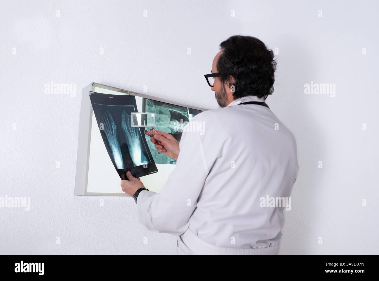 Doctor examines ray light screen hi-res stock photography and images ...