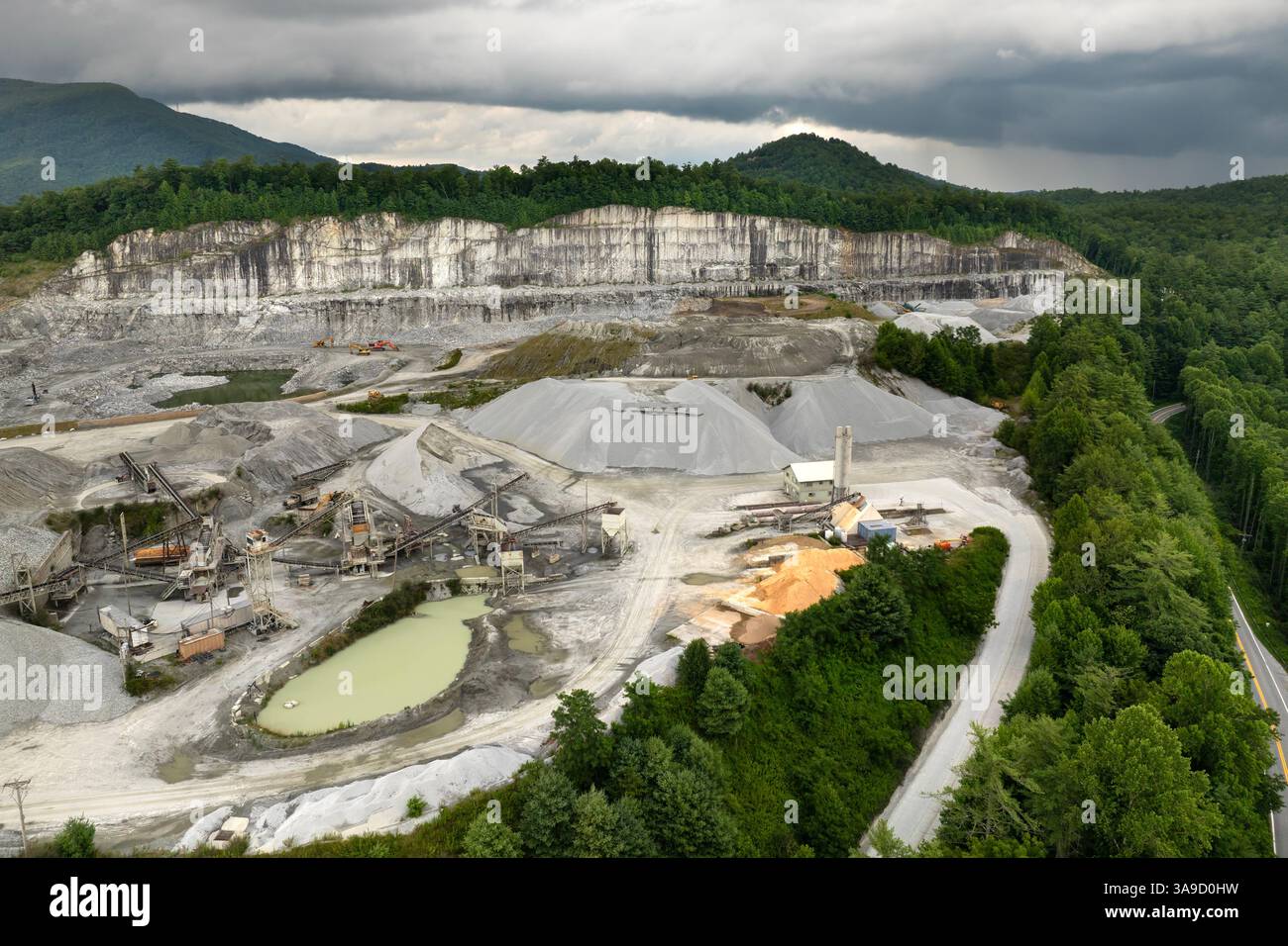 Sand open-pit mining quarry with processing plant for crushed stone. Extracting of natural ...