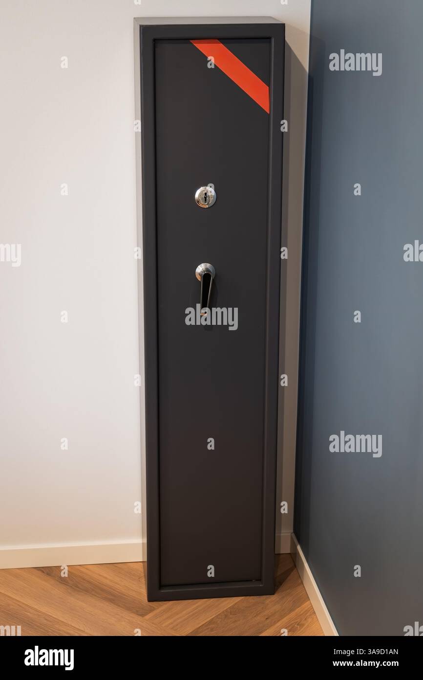 Gun safe for long-barreled weapons in an apartment Stock Photo - Alamy