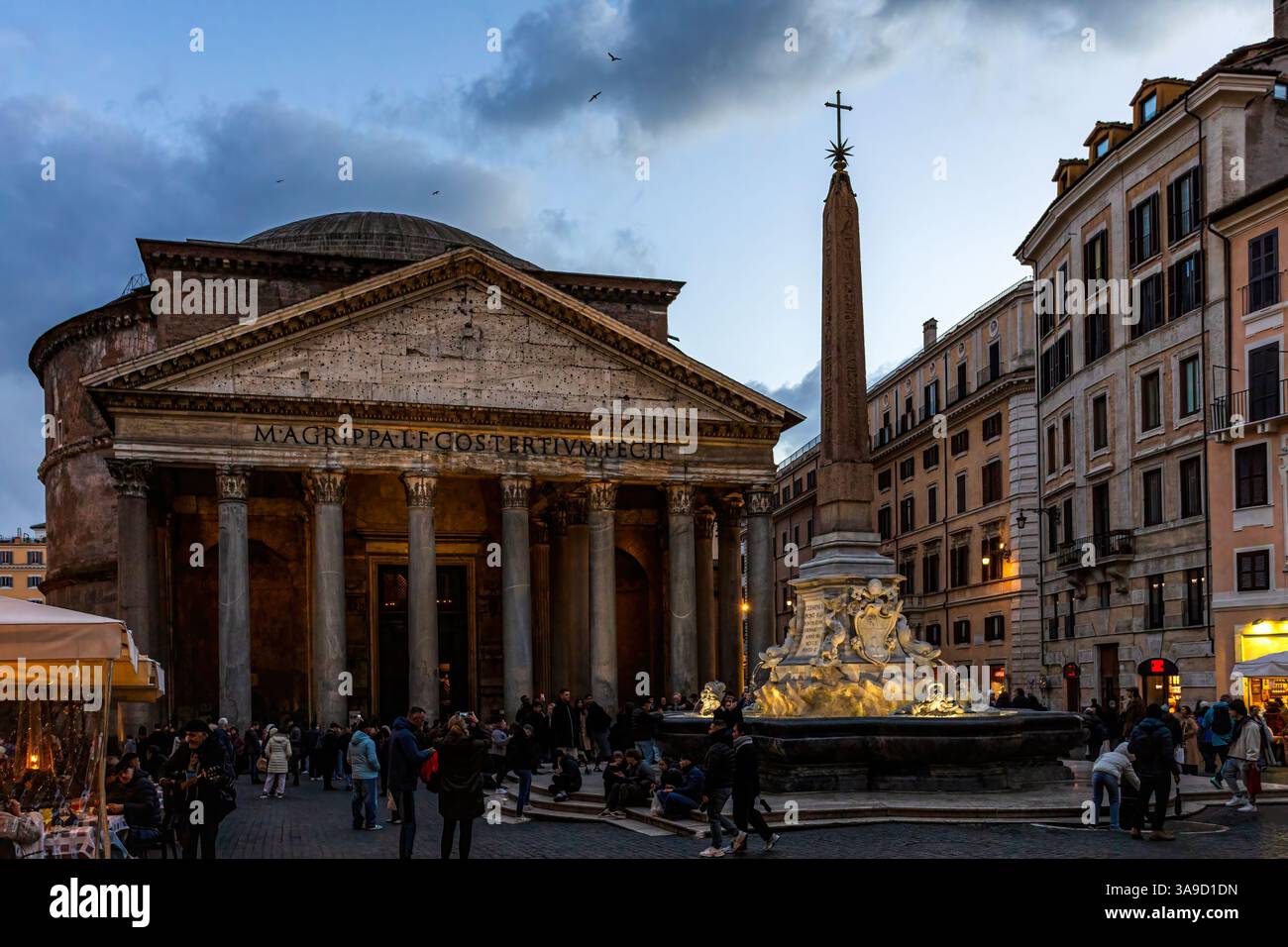 The ancient Pantheon square under the evening sky. The photo was taken ...