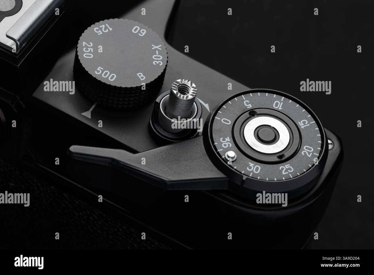 Shutter speed dial, cocking lever and frame counter of an old SLR film ...