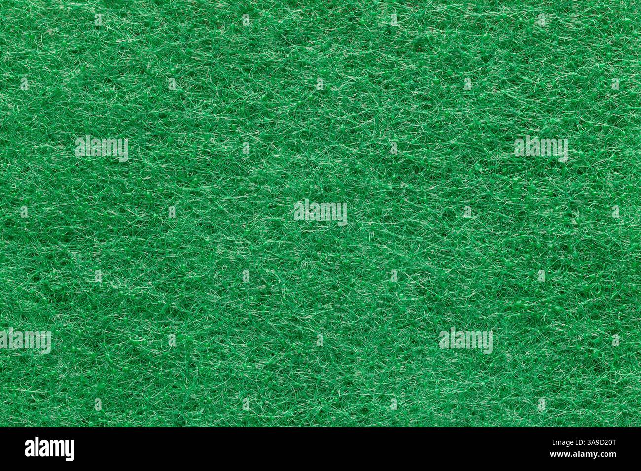 Abstract green background made of intertwined synthetic fibers. Macro ...