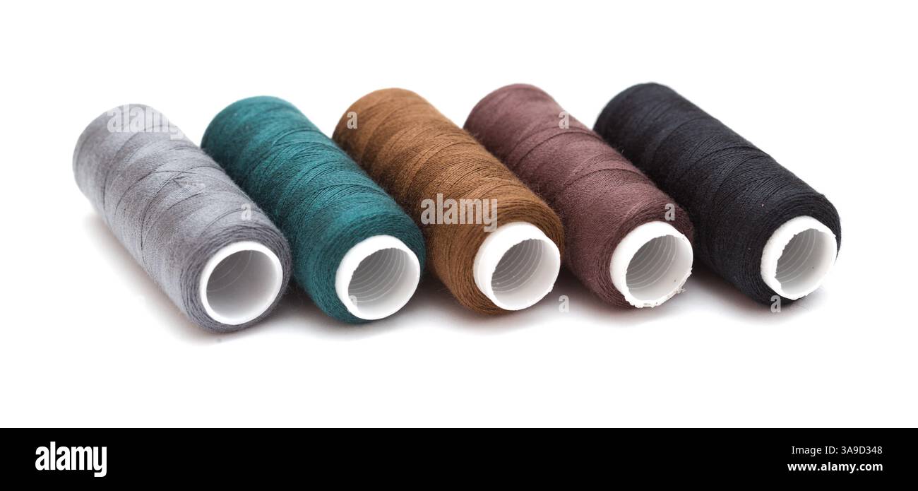 Full cross-wound spools of thin sewing tread Stock Photo - Alamy