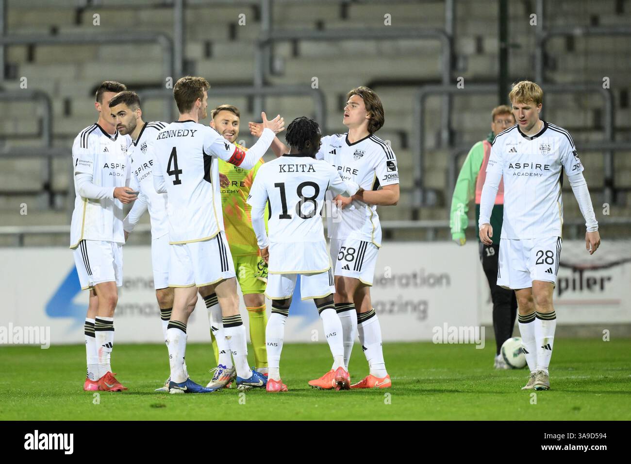 Eupen, Belgium. 30th Mar, 2025. Eupen's players celebrate after winning ...