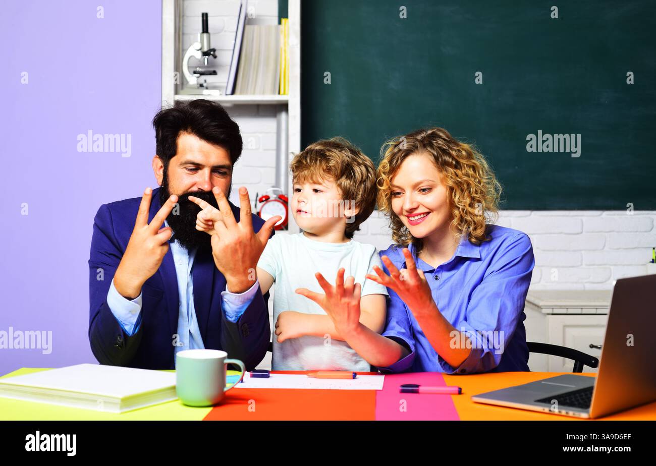 Schoolboy student doing math homework with tutors and learning to count ...