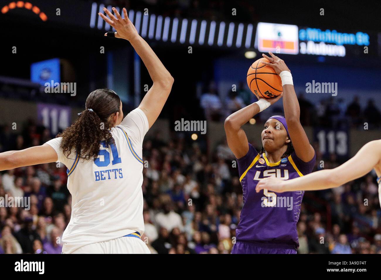 LSU forward Sa'Myah Smith (5) looks to shoot while pressured by UCLA center Lauren Betts (51 ...