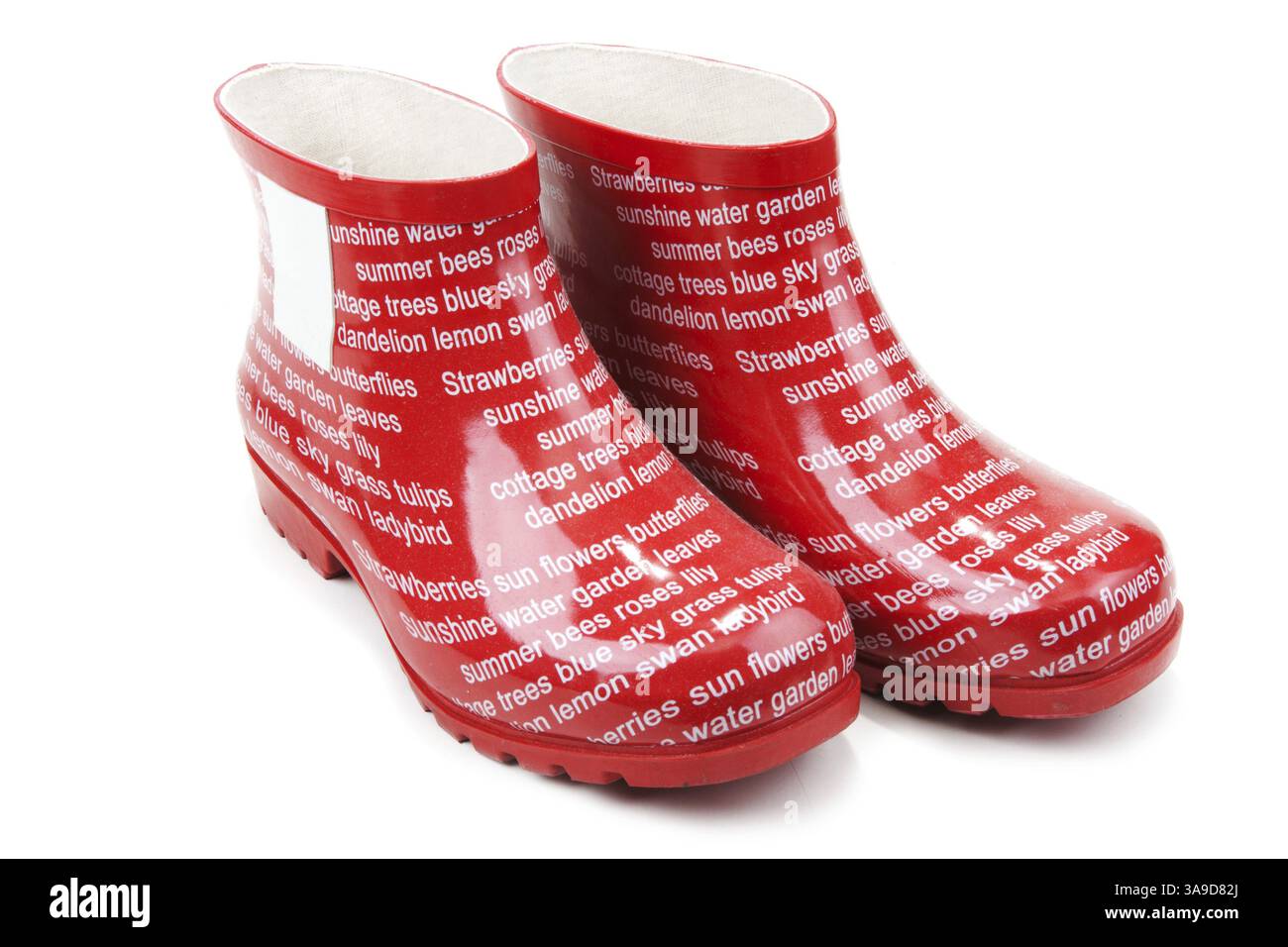 Red rubber boots with inscription on white background Stock Photo - Alamy