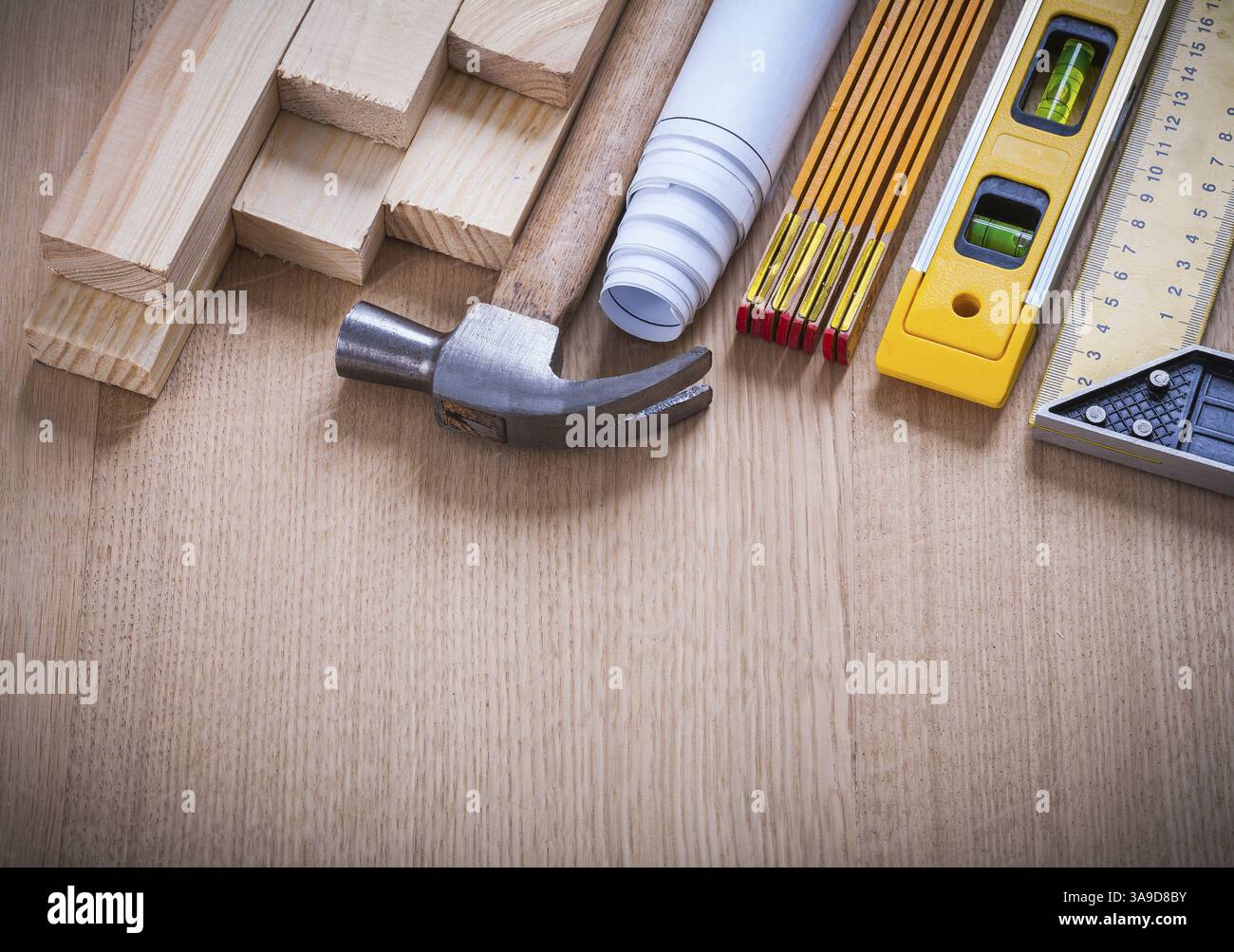 Wooden studs and meter try square ruler claw hammer blueprints ...