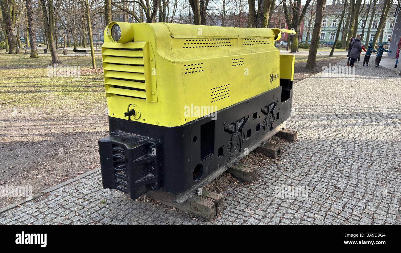 Old yellow diesel locomotive. Underground coal mine transport rail ...