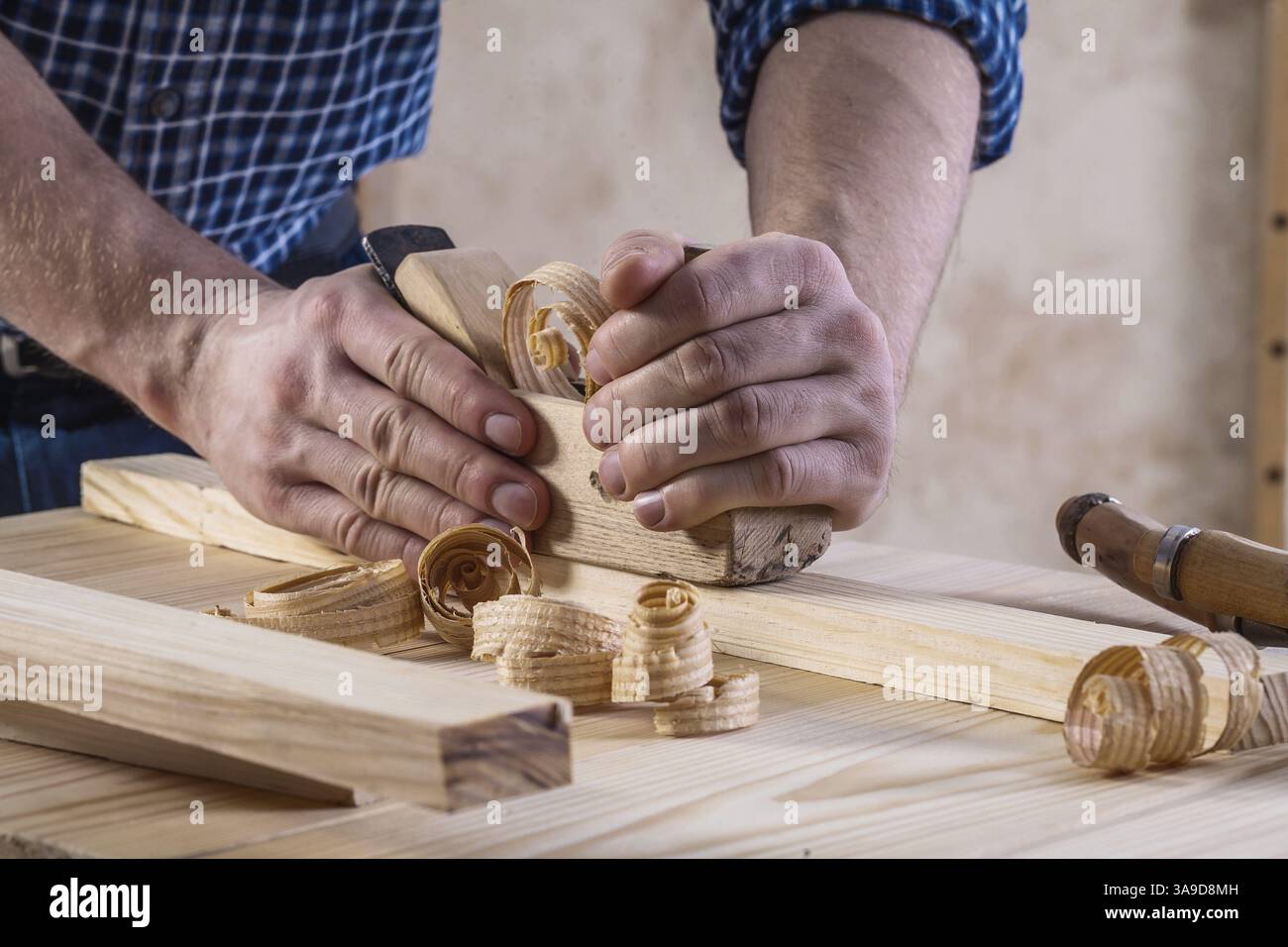 Joiners hands with woodworkers plane in work Stock Photo - Alamy