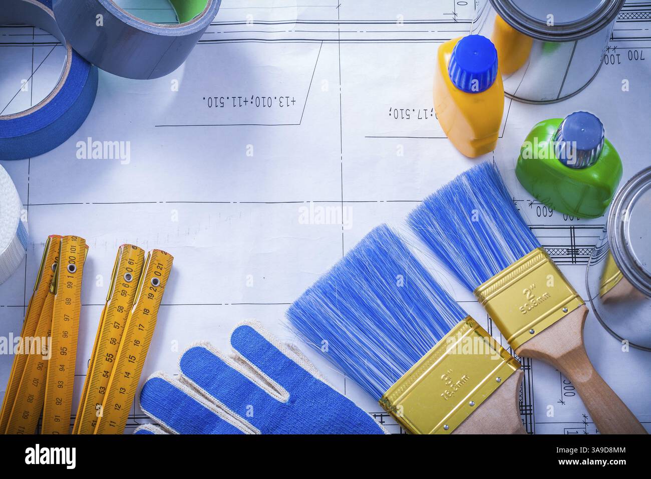 Wooden meter household tapes protective gloves and paint tools on ...