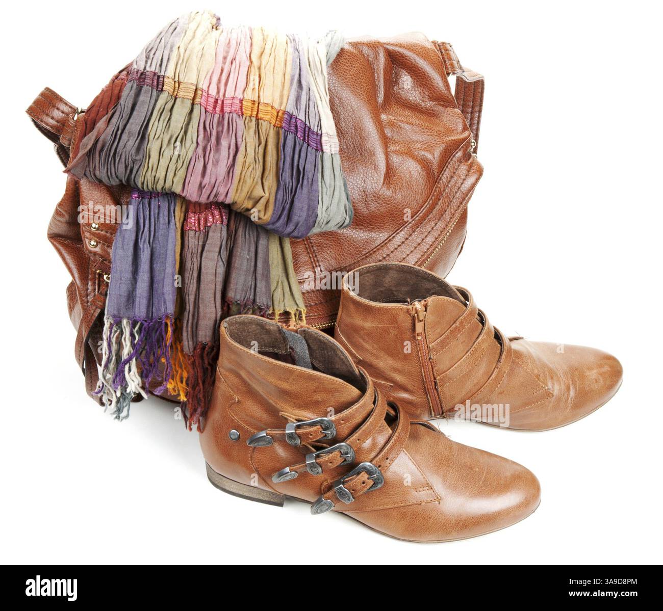 Brown leather bag, scarf and pair feminine boots on white background ...