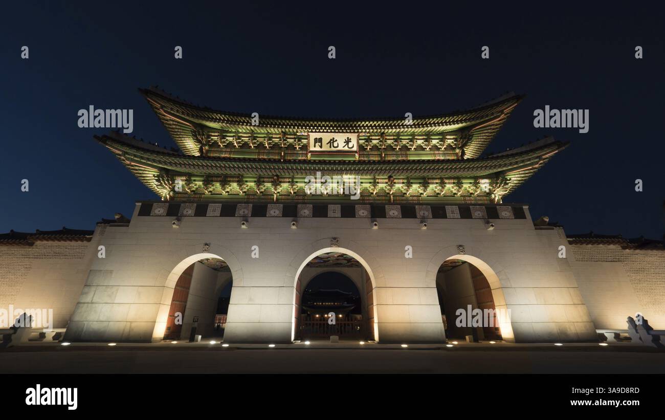 Low angle shot of the illuminated three-portal Gwanghwamun Gate at ...