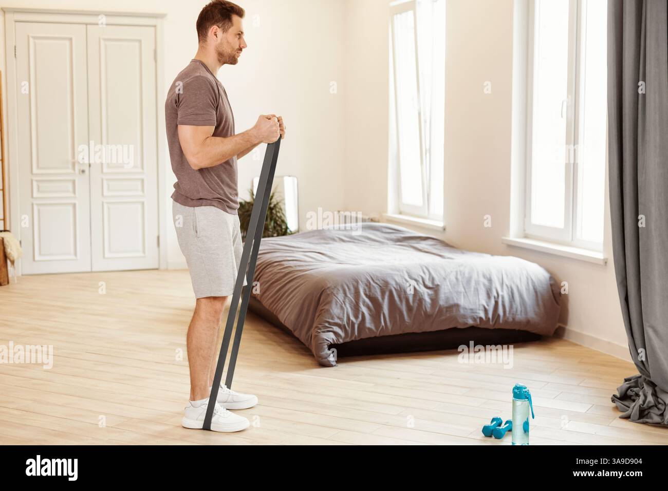 Fitness man using sport loop hi-res stock photography and images - Alamy