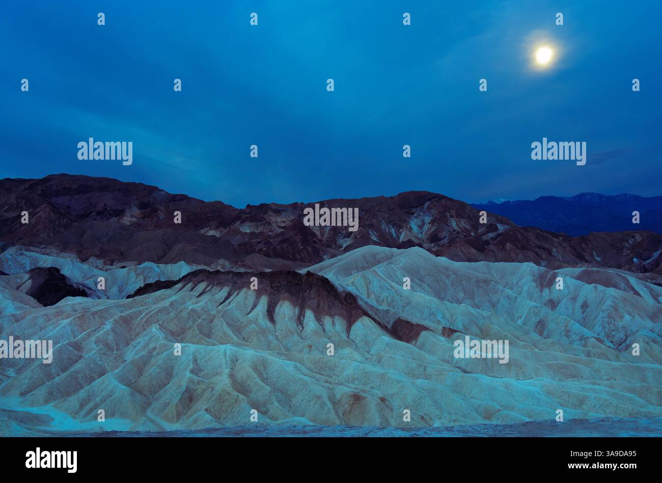 Death Valley, Zabriskie Point at stormy night under full moon, Death ...