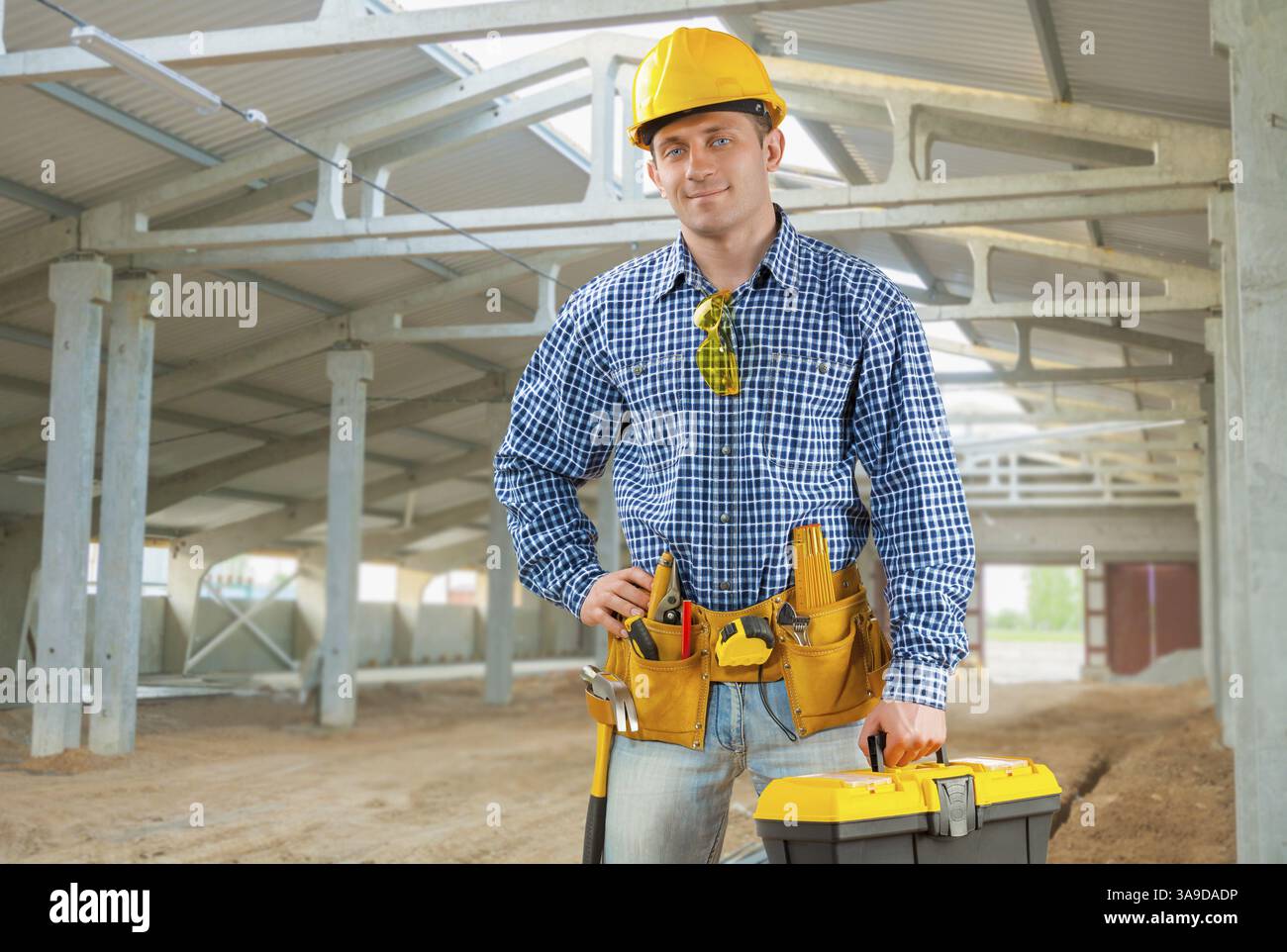 Handsome man with working tools Stock Photo - Alamy
