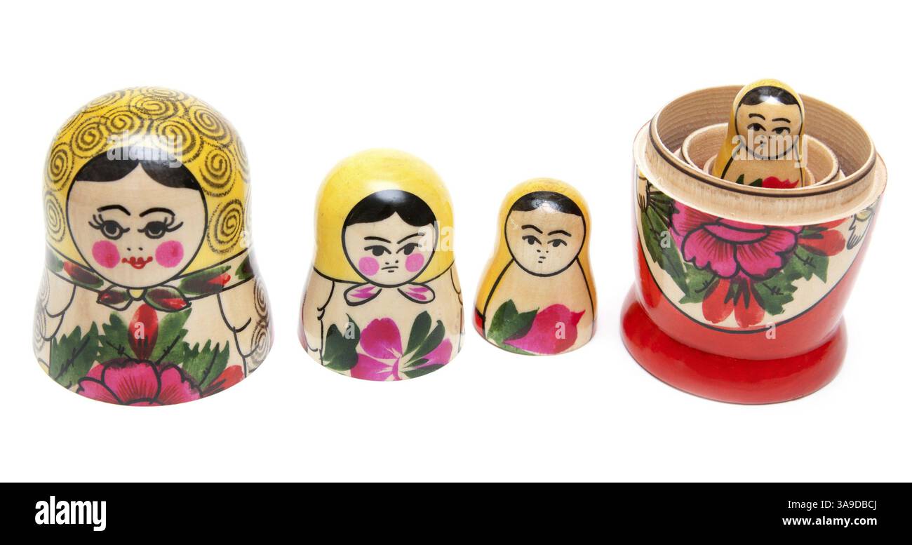 Sets of nesting dolls stand in row opened on white background Stock Photo - Alamy