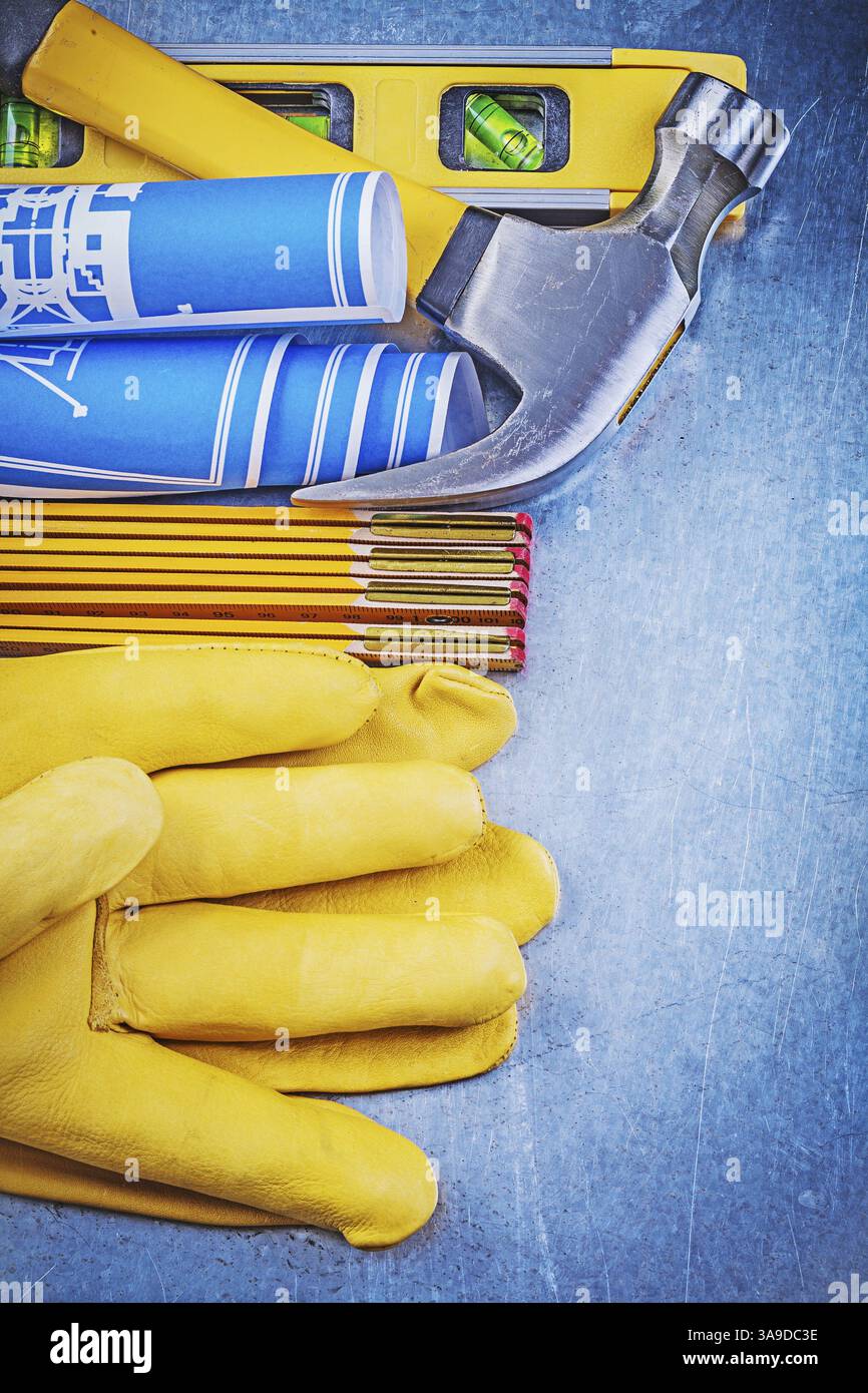 Working gloves claw hammer rolled construction drawings level wooden ...