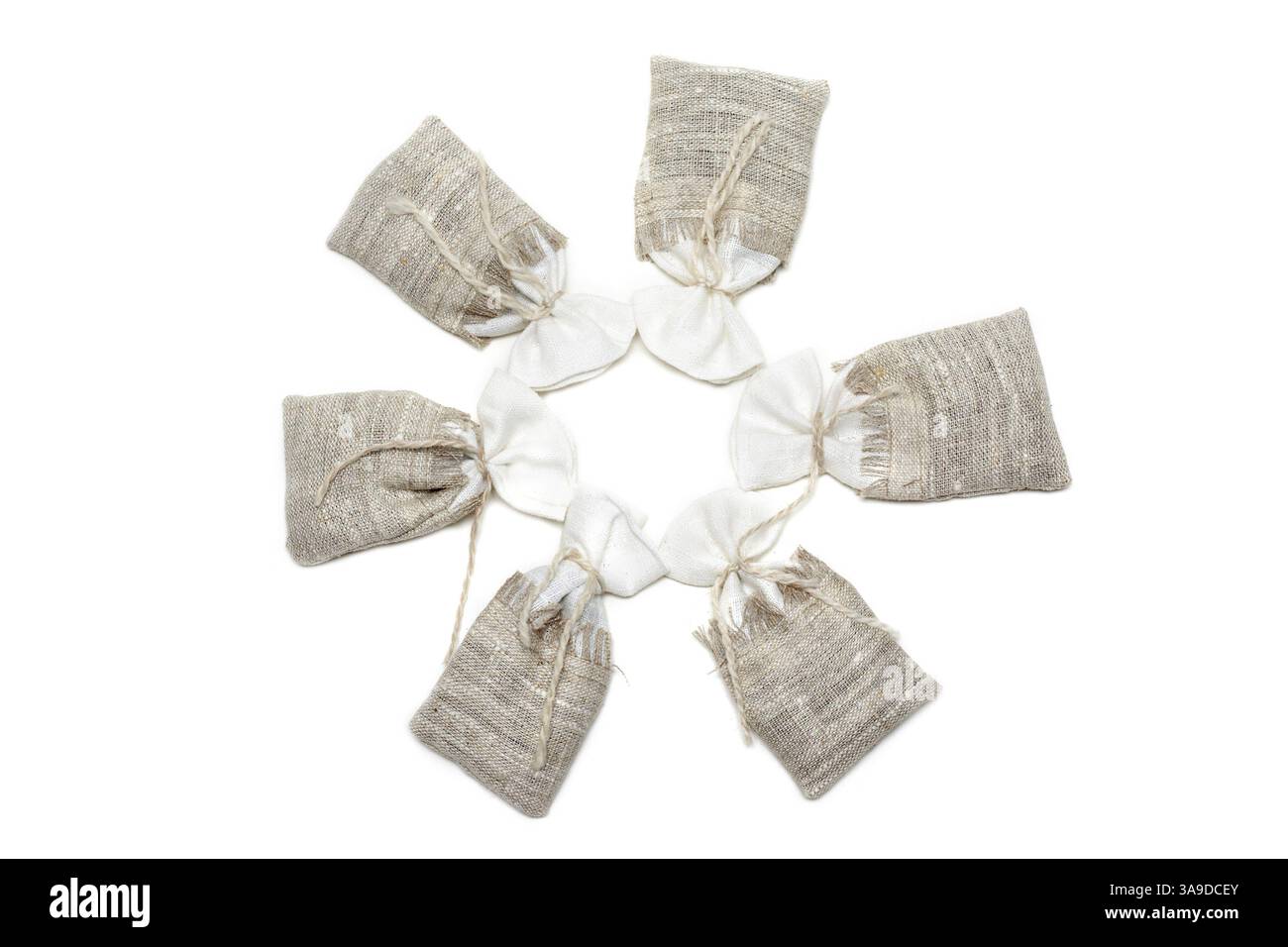 Sac pervaded spice and tied rope on white background Stock Photo - Alamy