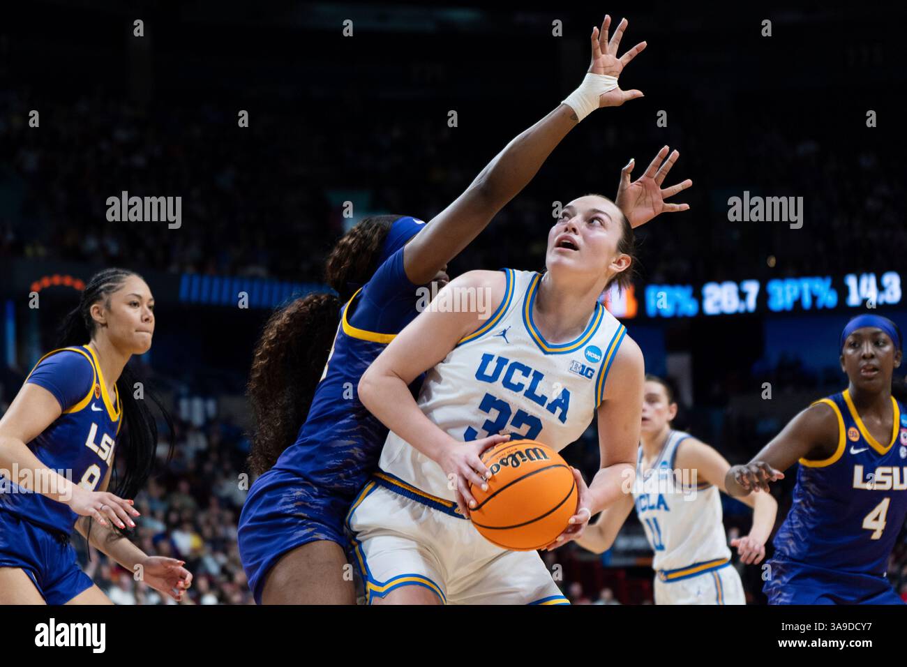 UCLA forward Amanda Muse (33) looks to shoot as LSU forward Aneesah Morrow defends during the ...