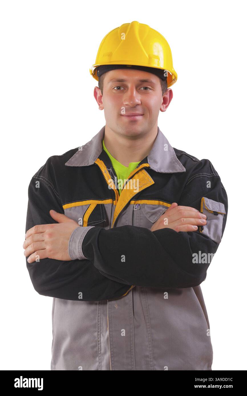 Young worker with crossed arms isolated Stock Photo - Alamy