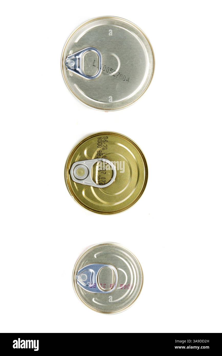 Three tins of the bank of the miscellaneous of the size on white ...