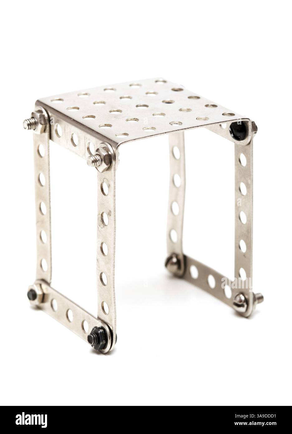 Steel building kit with bolts and nuts on white background Stock Photo ...