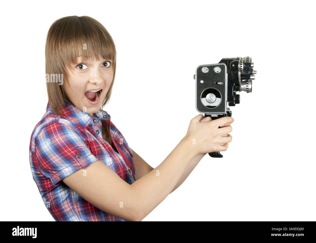 Beautiful girl in plaid shirt with movie camera on white background ...
