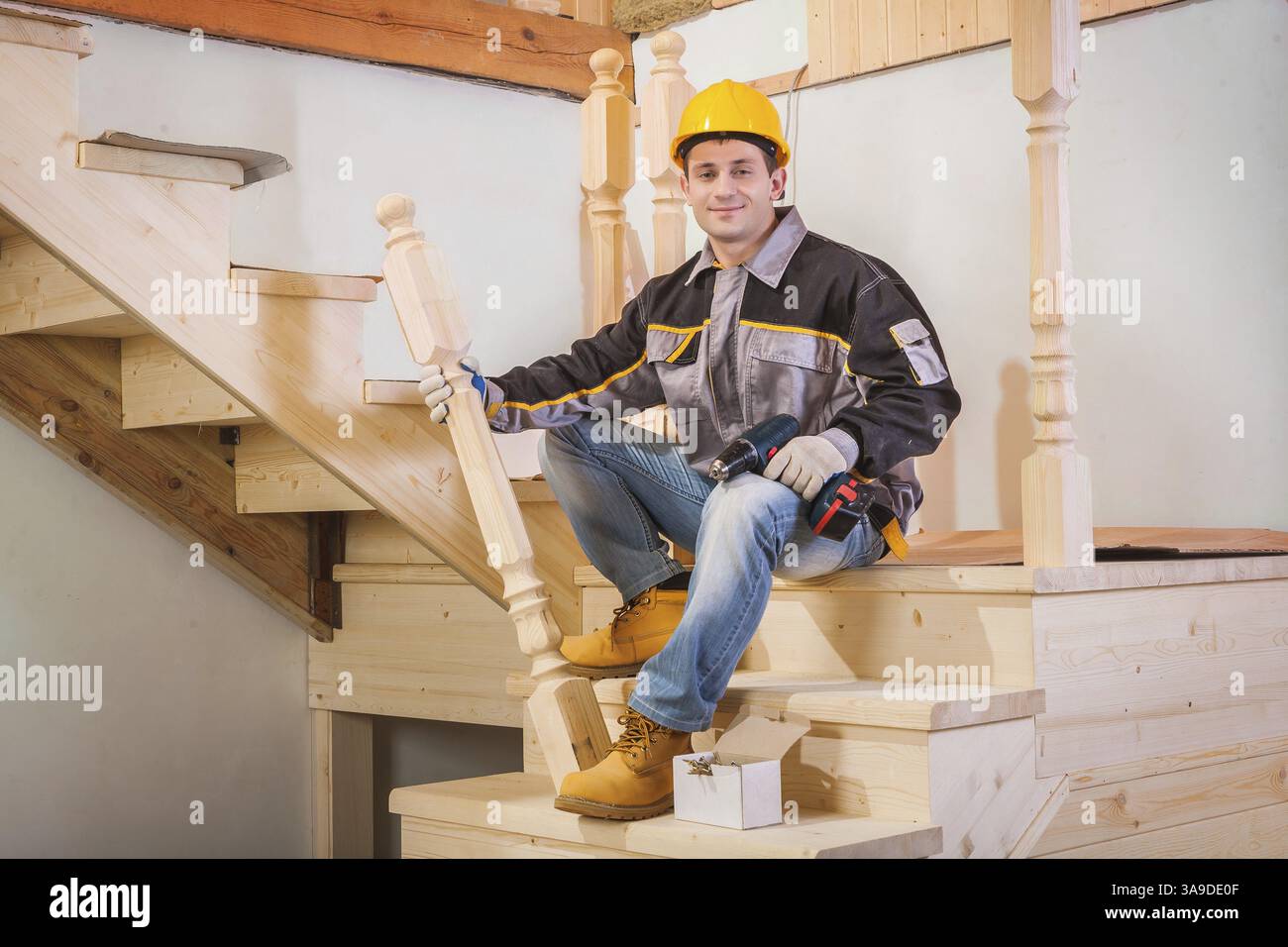 Portrait of sitting carpenter Stock Photo - Alamy