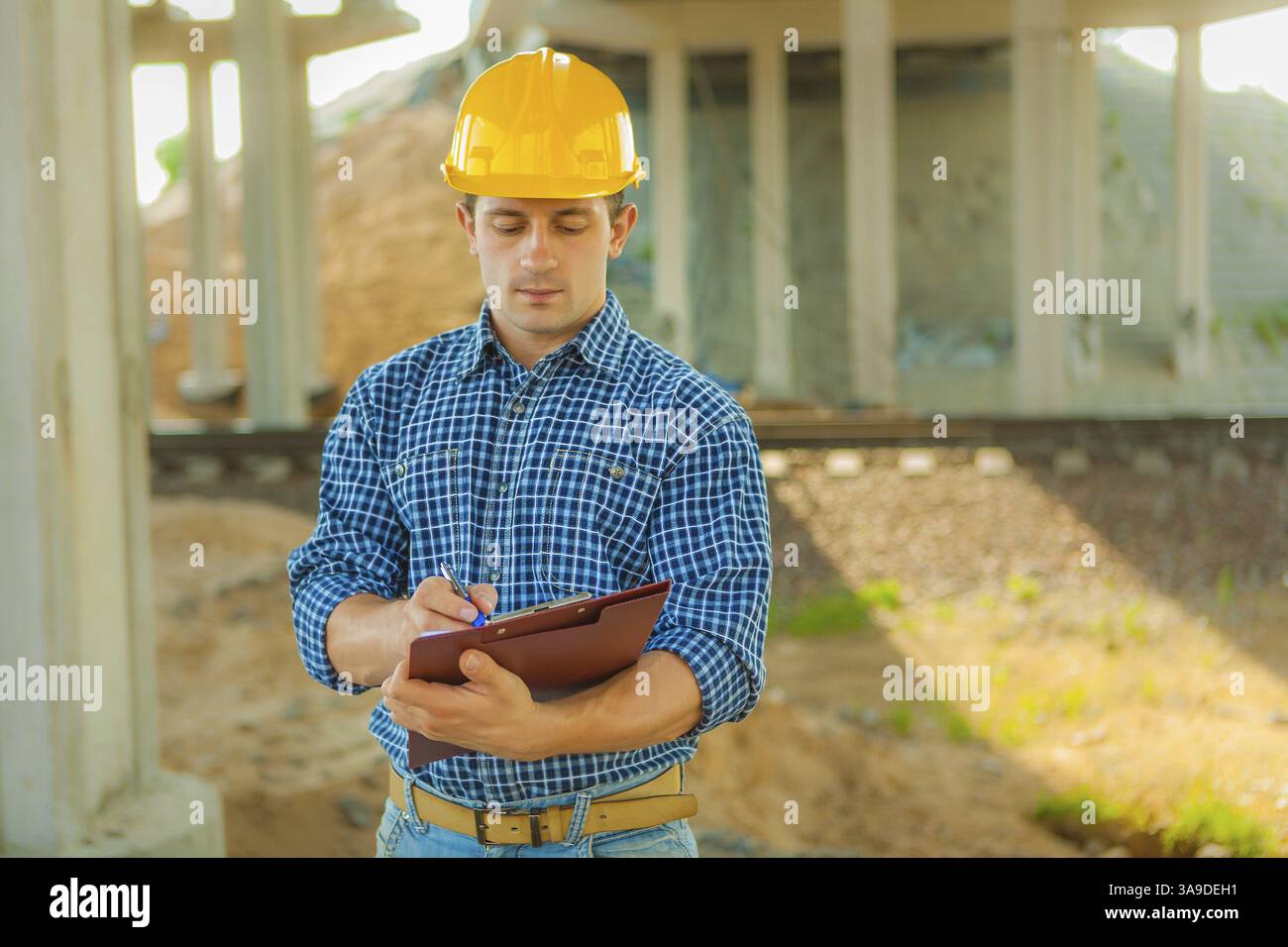 Young workers controlling work hi-res stock photography and images - Alamy