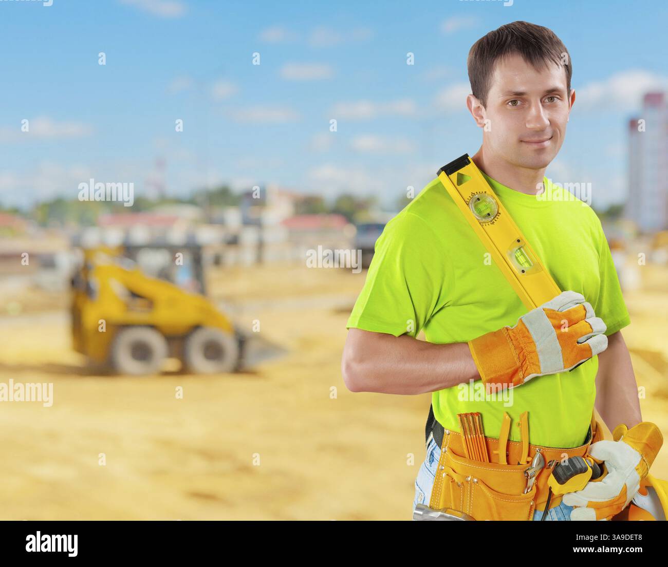 Worker holding construction lewel Stock Photo - Alamy