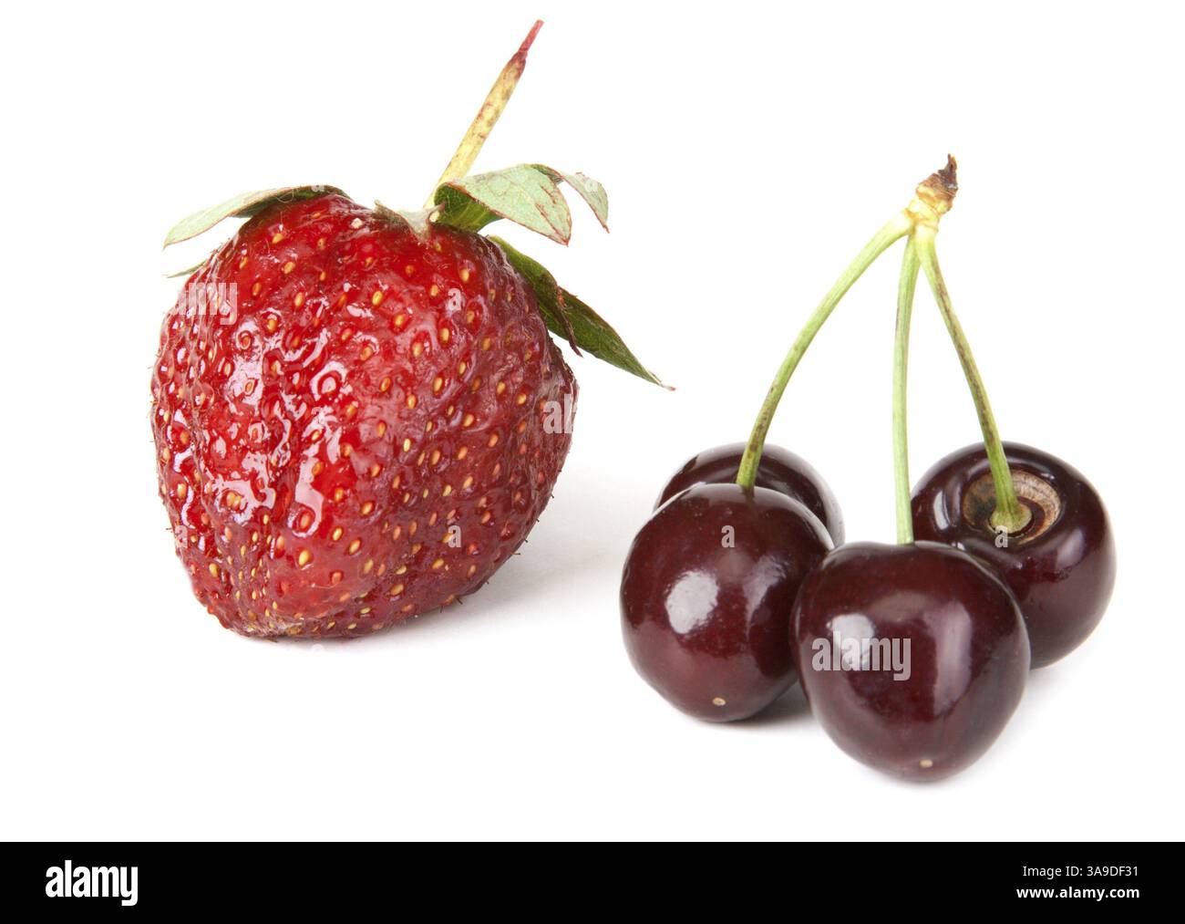 Strawberries and sweet cherries on white background Stock Photo - Alamy