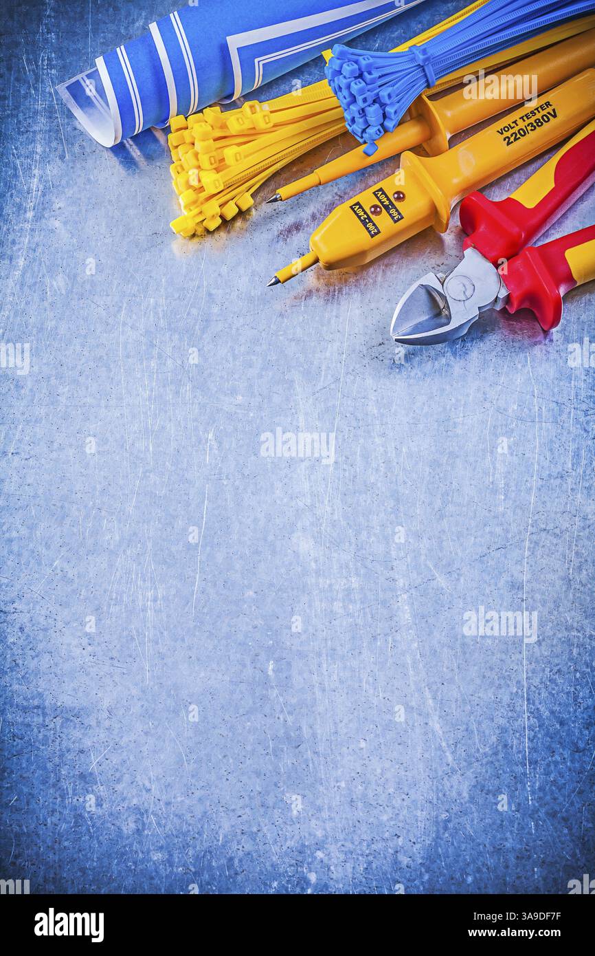 Yellow electrical tester self-locking tying cables blue blueprints ...