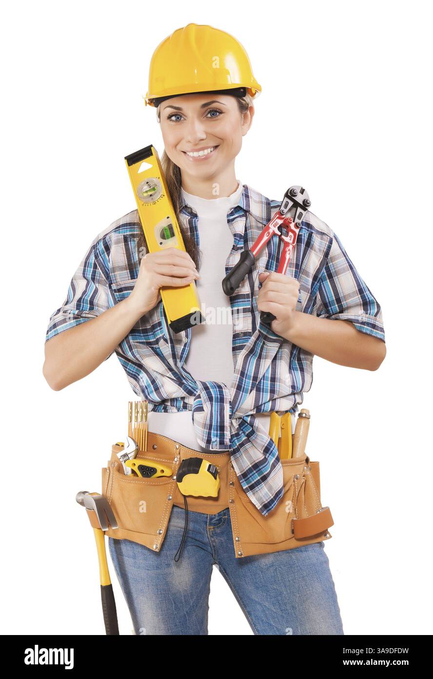 Beautiful female worker holding tools Stock Photo - Alamy