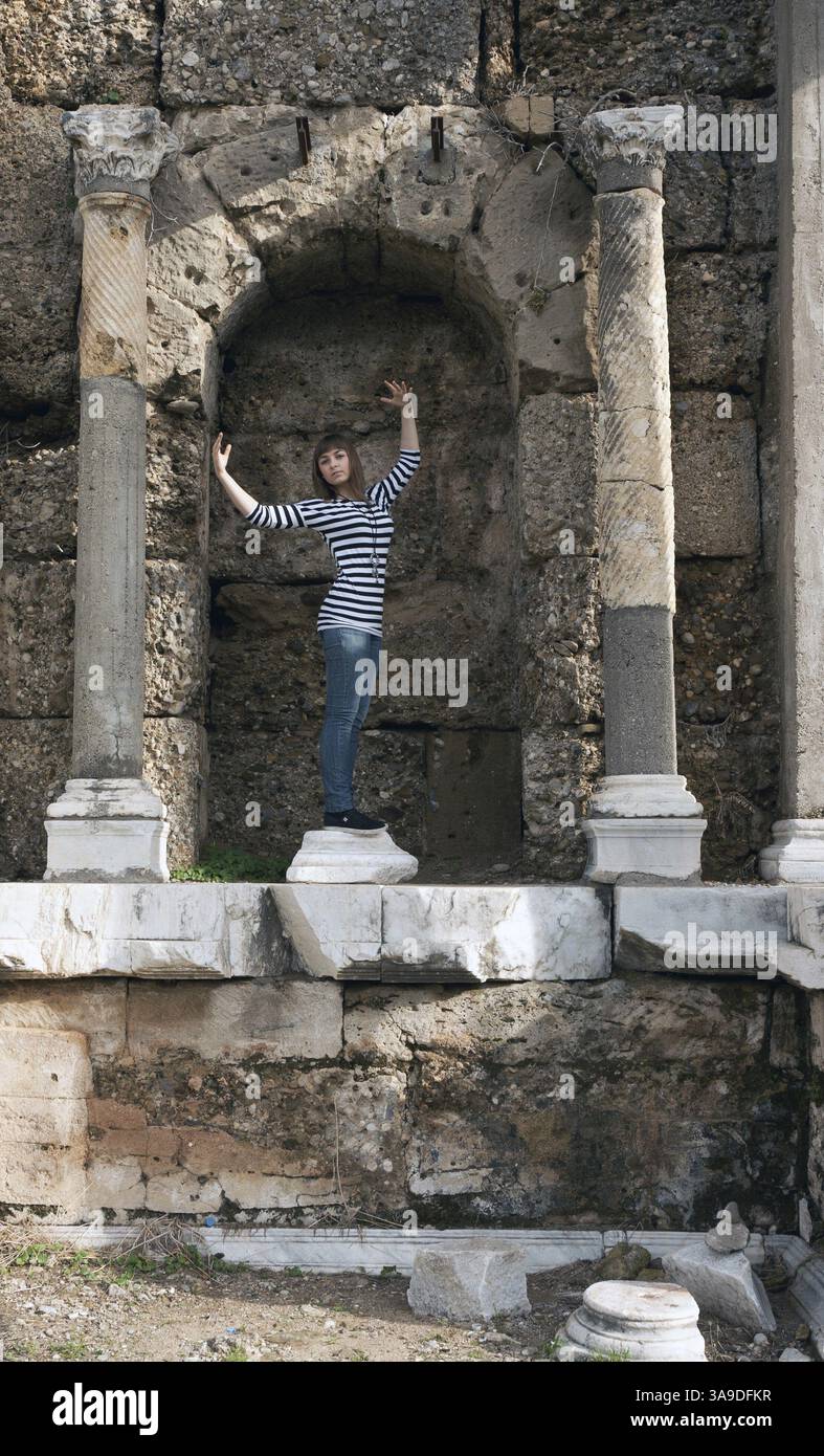 The girl in the ruins of the statue depicts Stock Photo - Alamy