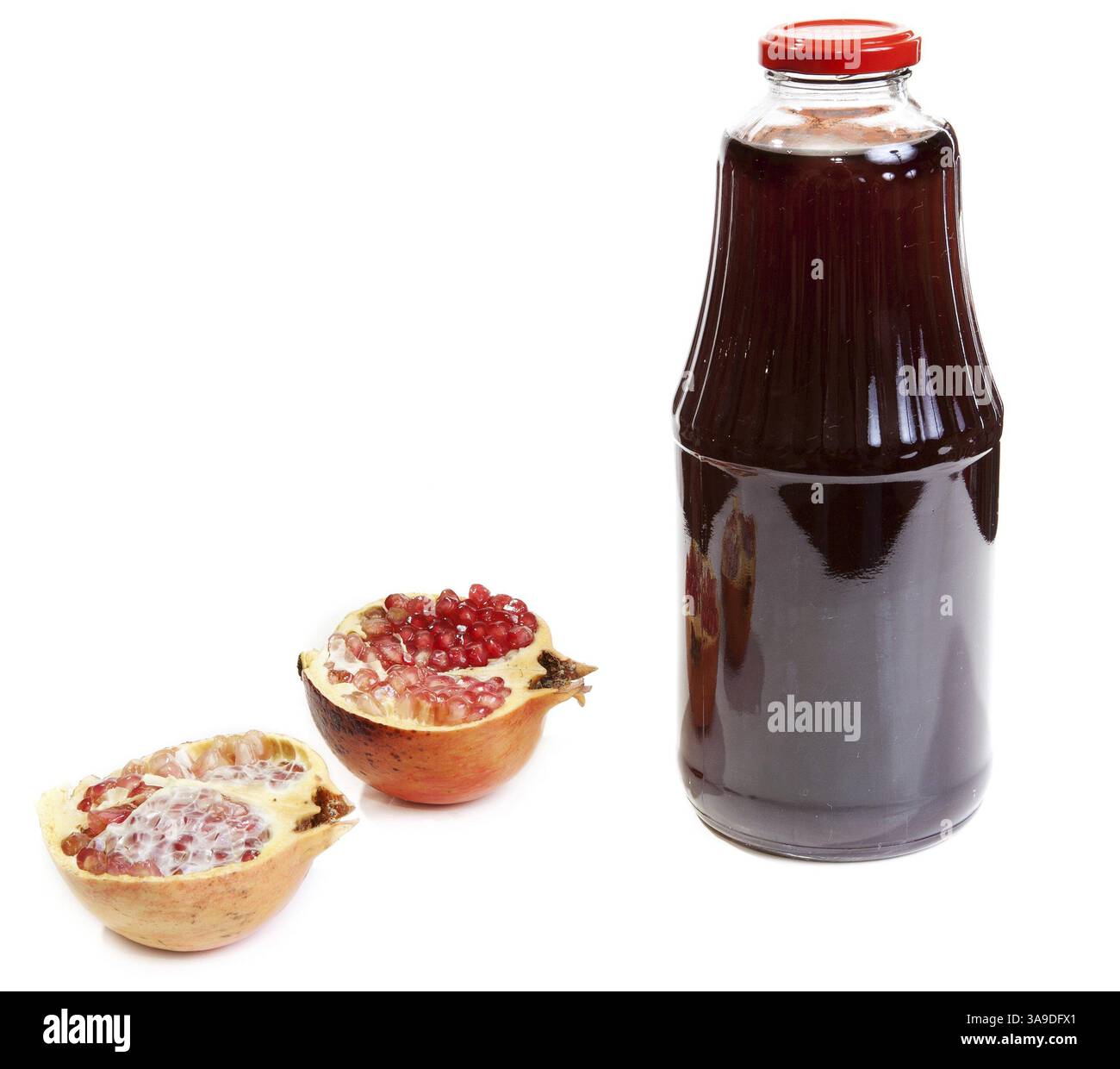Bottle of juice and ripe piece grenade on white background Stock Photo ...