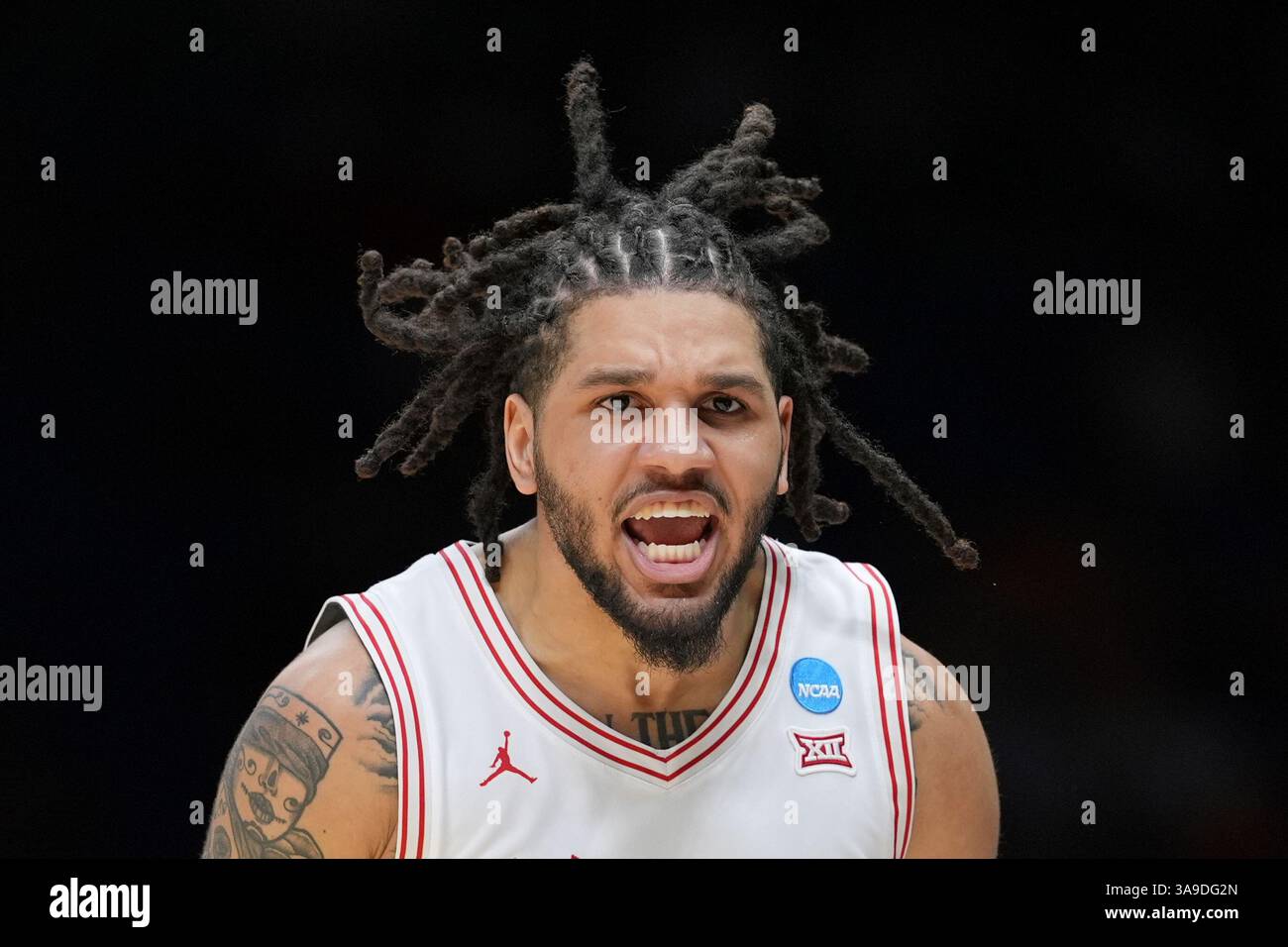 Houston's Emanuel Sharp celebrates during the second half in the Elite ...