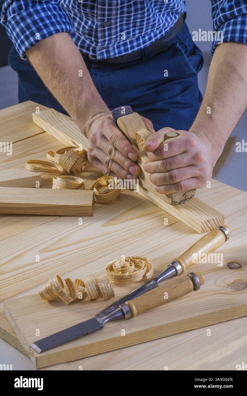 Work of joiner with woodworkers plane Stock Photo - Alamy
