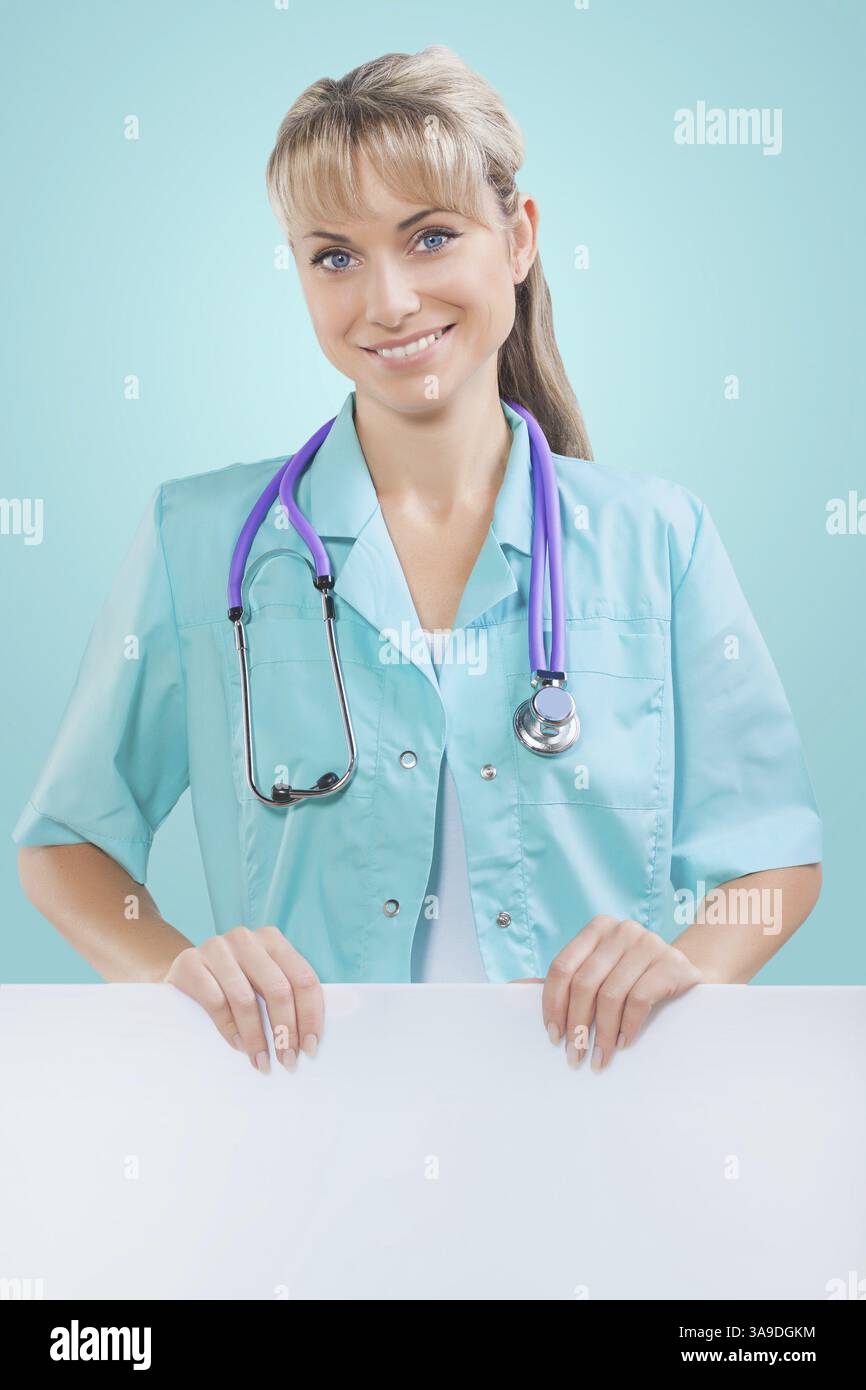 Female doctor presenting empty board Stock Photo - Alamy