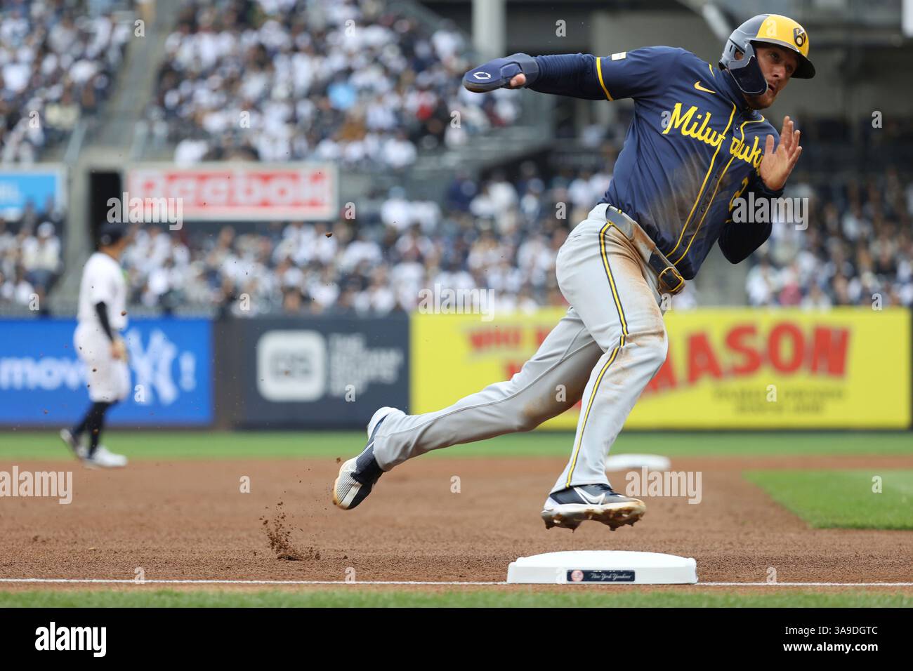 Milwaukee Brewers' Brice Turang runs to score on a hit by Sal Frelick ...