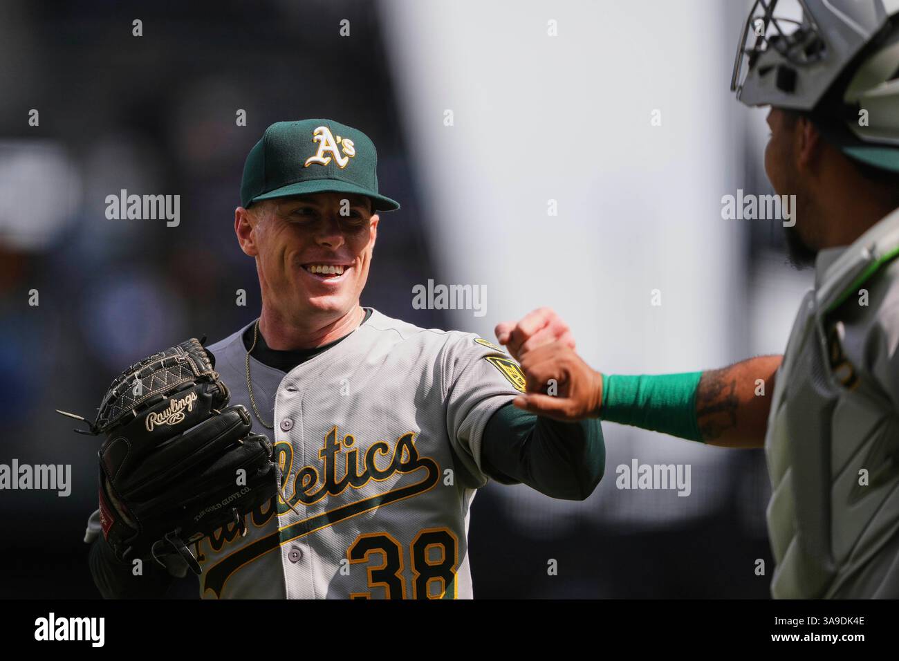 Athletics starting pitcher JP Sears, left, greets catcher Jhonny Pereda ...