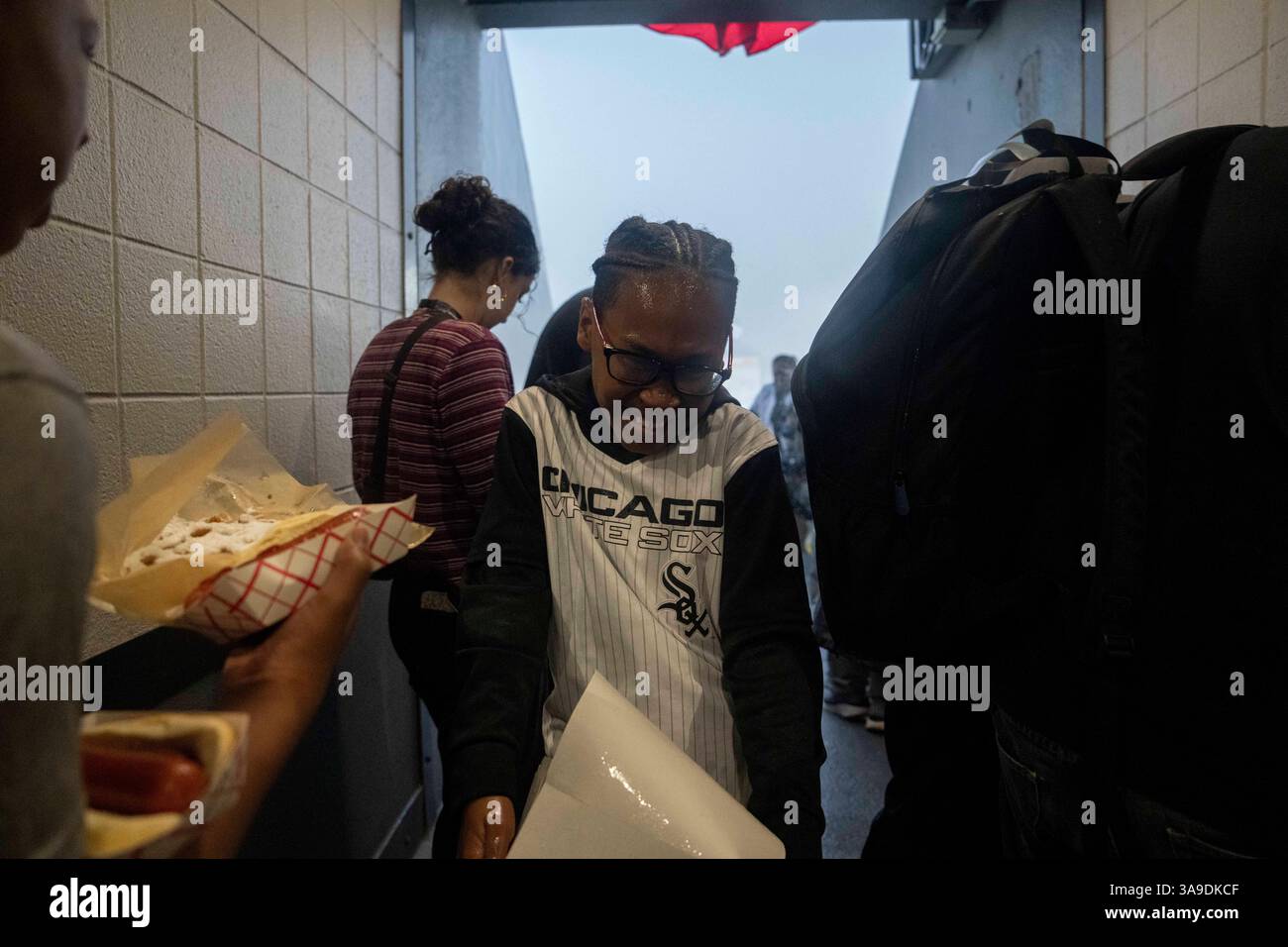 CHICAGO, IL - MARCH 30: A young fan runs inside away from the severe ...
