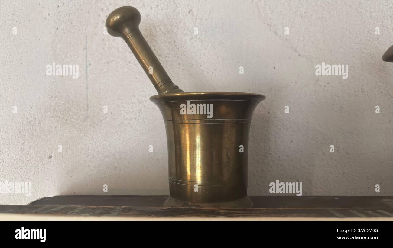 Vintage old metal bronze Mortar and pestle kitchen utensil. Traditional ...